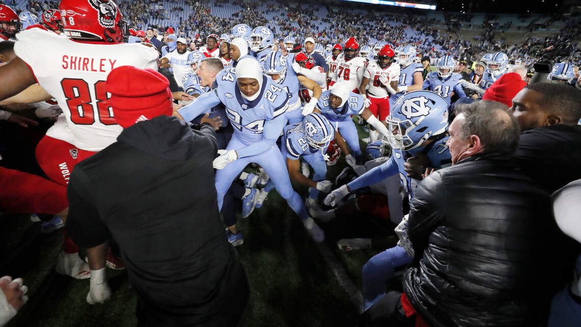ACC fines UNC, NC State after fights at rivalry football games ...